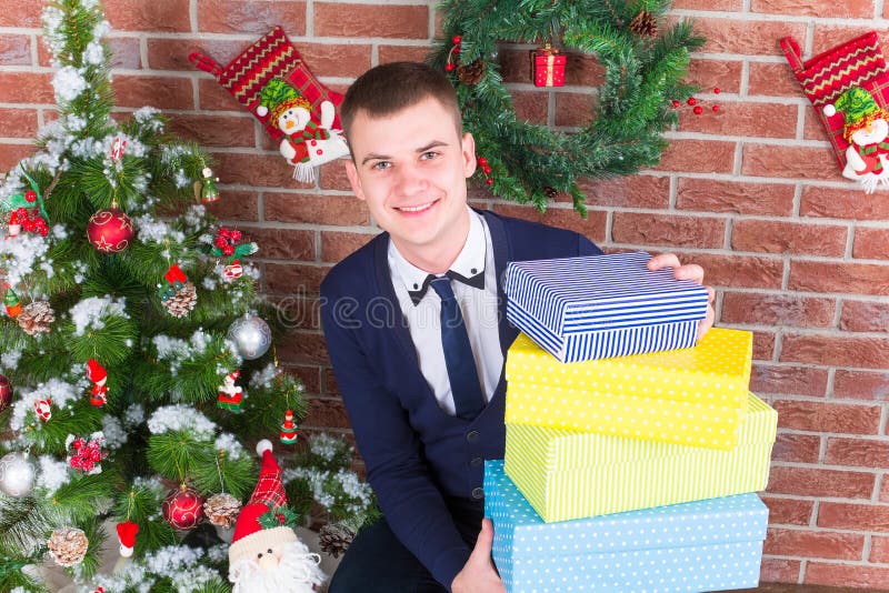 Young Guy Next To a Christmas Tree Stock Photo - Image of young, people ...