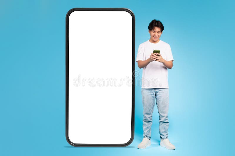 Young Guy with Phone beside Blank Screen Stock Photo - Image of ...
