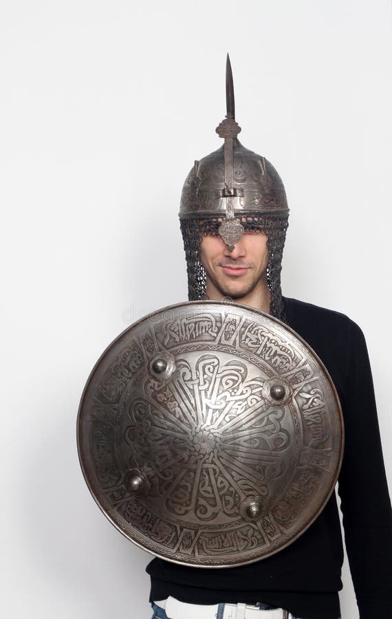 Young Guy is Posing in Studio with Helmet and Shield. Knight, Halloween ...