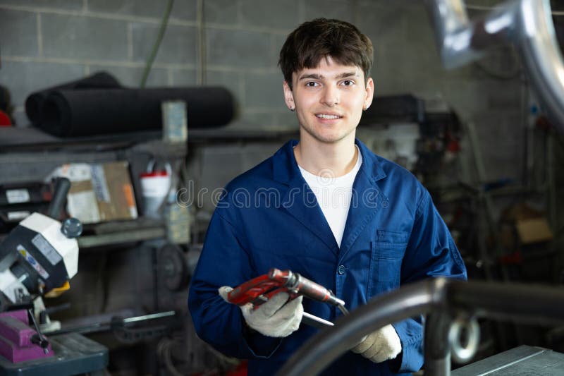 Young Guy Posing with Vice in Workshop Stock Photo - Image of worker ...