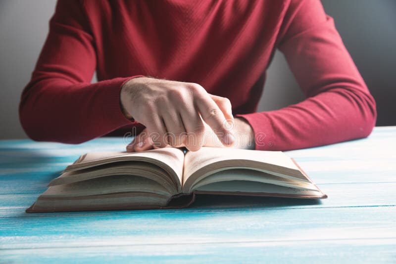 Young guy reading a book stock image. Image of handsome - 215941837