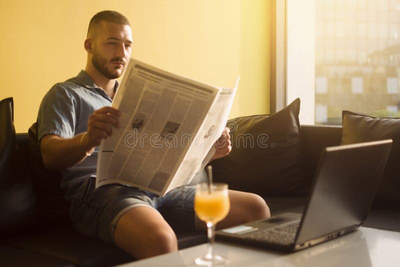 Young Guy Reading Newspaper Stock Photo - Image of student, relaxing ...