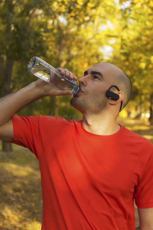 Young Guy Refreshing after Exercise in Park Stock Image - Image of ...