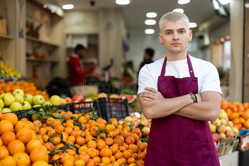 Young Guy Seller Posing at Vegetable Market Stock Photo - Image of ...