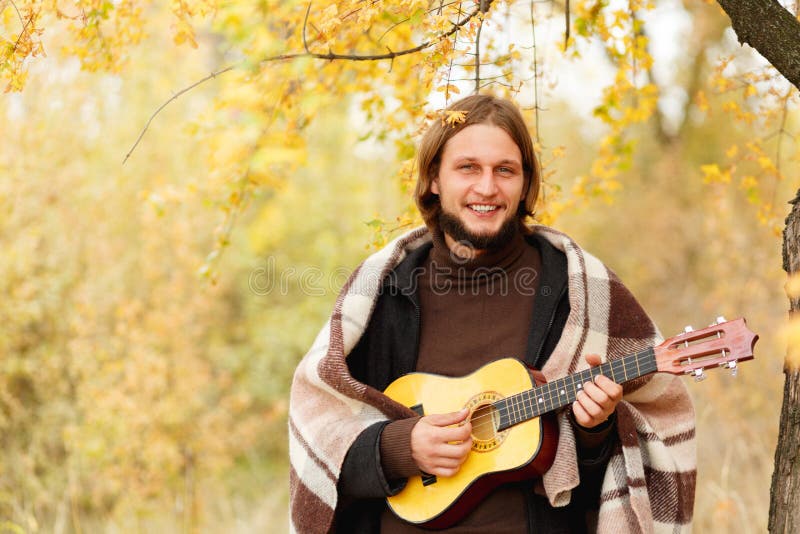 Young Guy Smiles with Ukulele in Hands Stock Photo - Image of country ...
