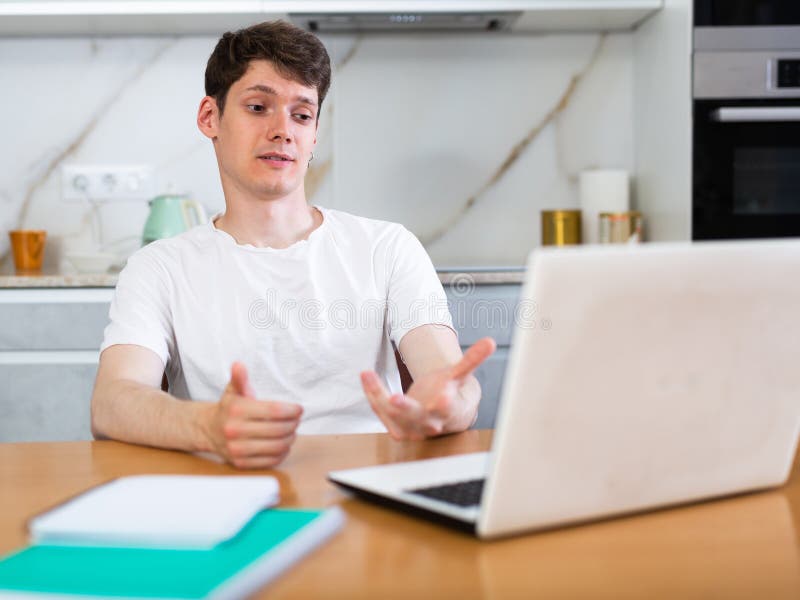 Young Guy Studying at Home with Laptop Stock Photo - Image of sitting ...