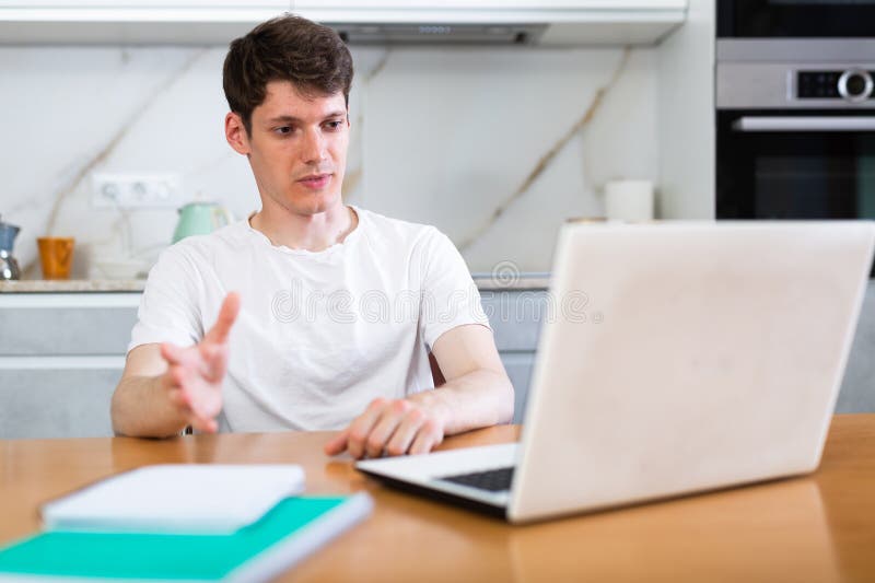 Young Guy Studying at Home with Laptop Stock Photo - Image of attentive ...