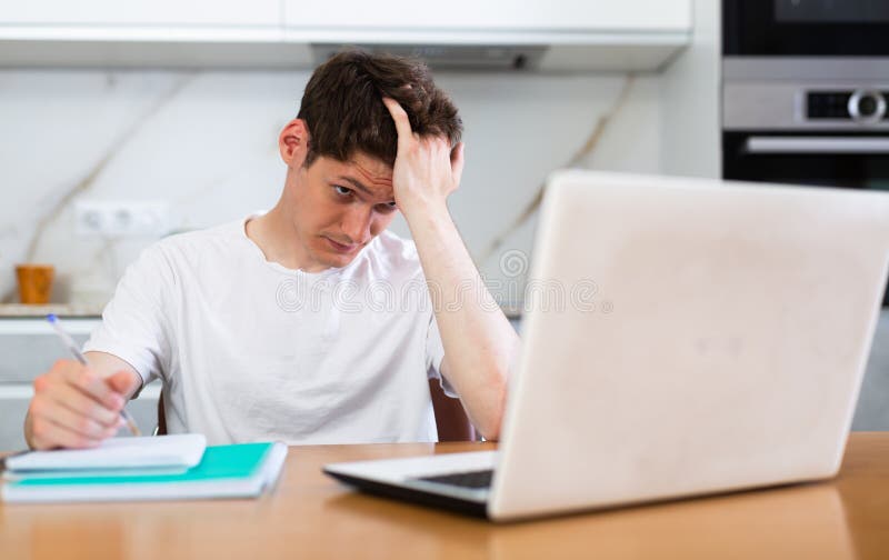 Young Guy Studying at Home with Laptop Stock Photo - Image of pose ...