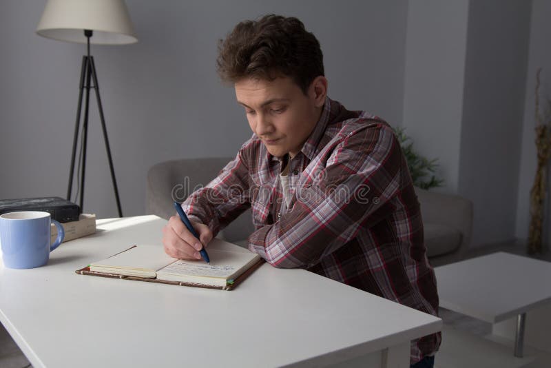 Young Guy Studying at Home. Stock Photo - Image of person, home: 138051382