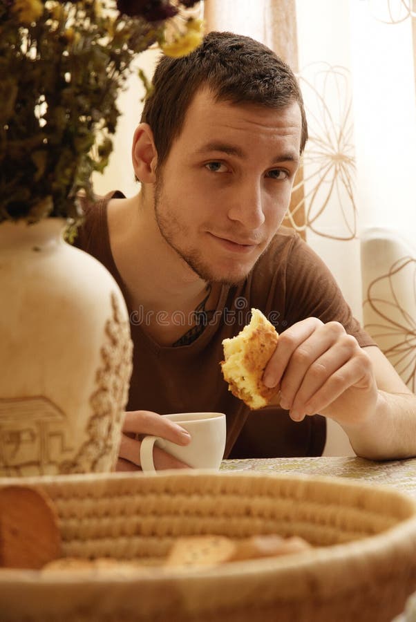 Young Guy with Tea and Cake in the Kitchen Stock Image - Image of brown ...