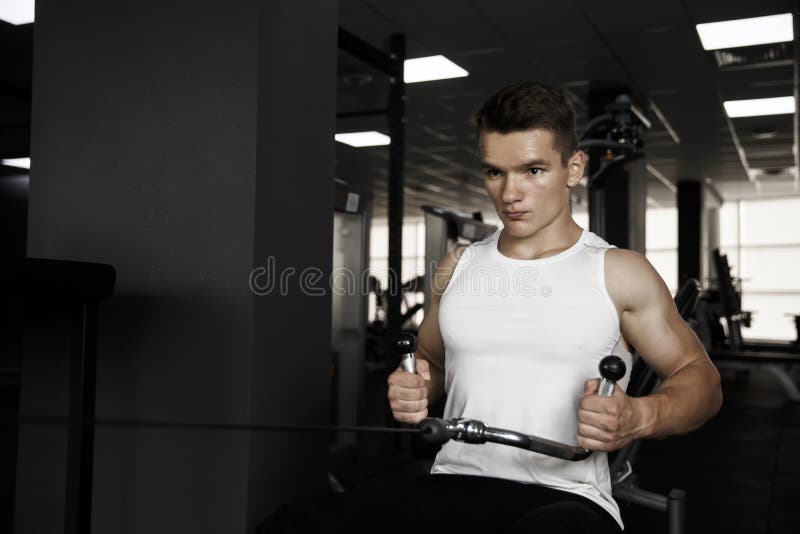 Young Guy is Training in the Gym Stock Image - Image of motion, side ...