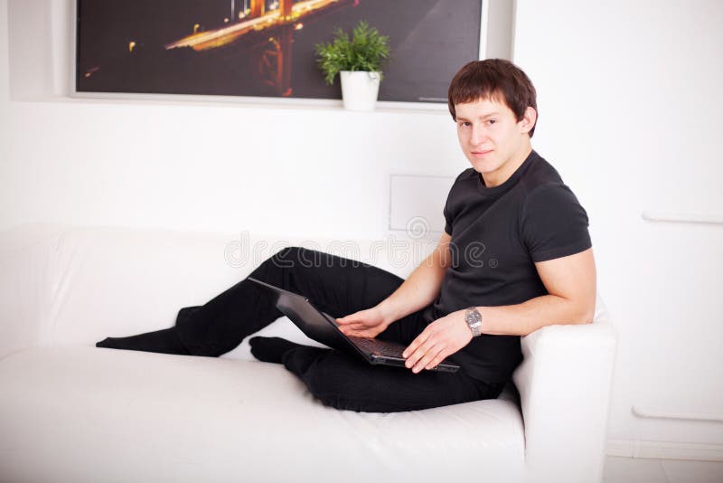 Young guy using laptop stock image. Image of positive - 29958665