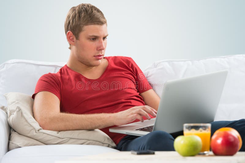 Young Guy Using Laptop at Home Stock Image - Image of isolated ...