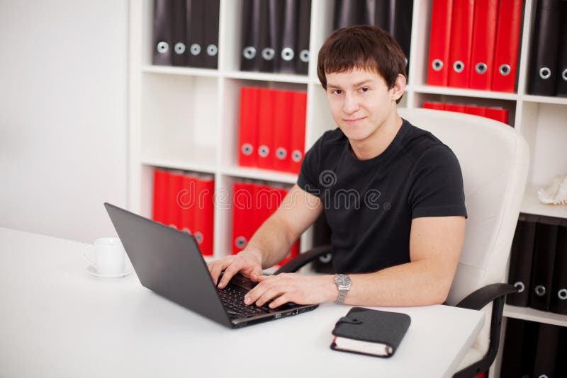 Young guy using laptop stock photo. Image of happy, notebook - 29958452