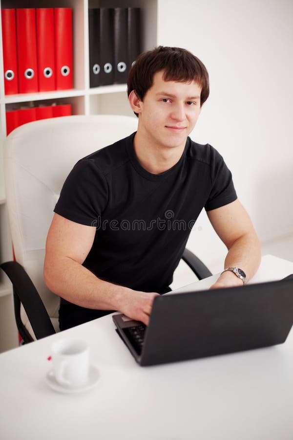 Young guy using laptop stock image. Image of employee - 29958545