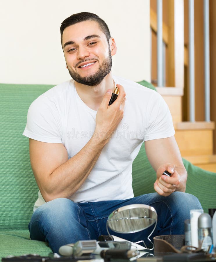 Young Guy Using Perfume at Home Stock Image - Image of face, reflection ...