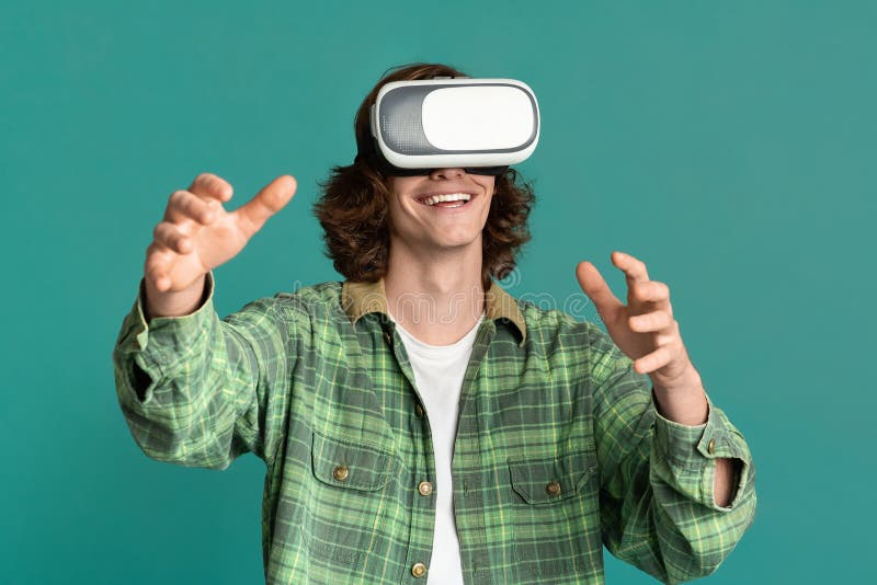 Young Guy in Virtual Reality Headset Playing Computer Games on ...