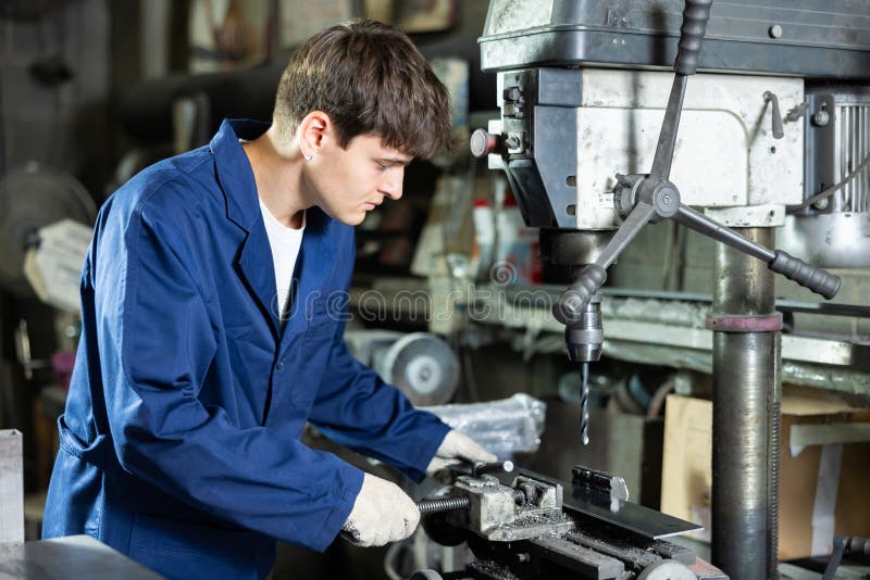 Young Guy Working with Drill Machine Stock Image - Image of heavy, 2025 ...