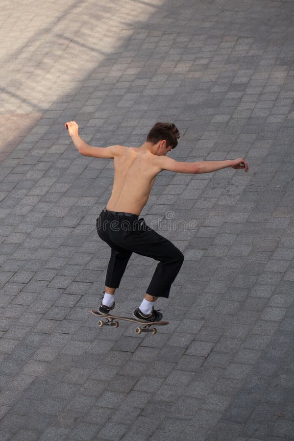 Young Guys in Stylish Clothes Ride a Skateboard Editorial Photography ...