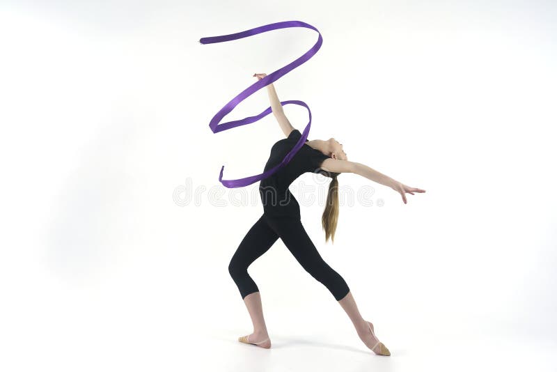 Young Gymnast in a Photo Studio Shows the Elements of Exercises with a ...