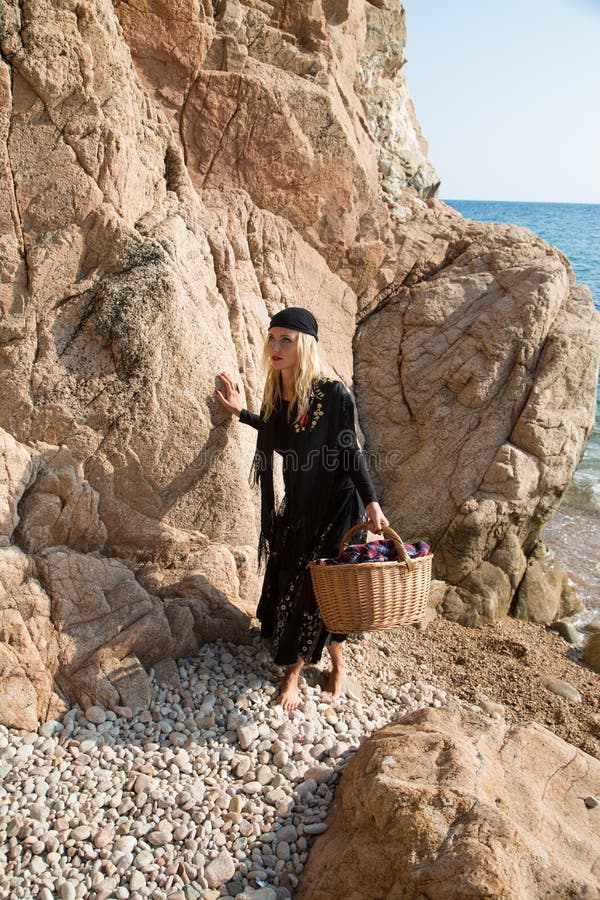 Young Gypsy Walking on the Rocky Beach Stock Photo - Image of coast ...