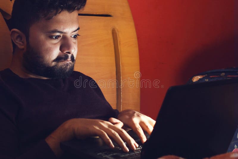 Young Hacker Looking at Laptop and Getting in Dark Room Stock Image ...