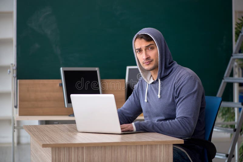 Young Male Hacker Sitting in the Classroom Stock Photo - Image of ...