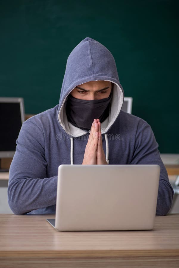 Young Male Hacker Sitting in the Classroom Stock Image - Image of ...