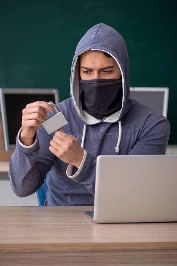 Young Male Hacker Sitting in the Classroom Stock Image - Image of ...