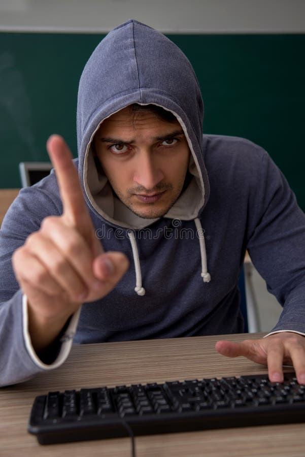 Young Male Hacker Sitting in the Classroom Stock Image - Image of ...