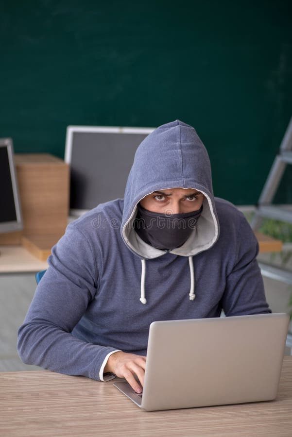 Young Male Hacker Sitting in the Classroom Stock Image - Image of ...