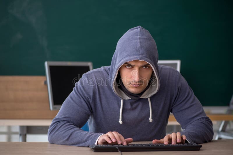 Young Male Hacker Sitting in the Classroom Stock Image - Image of ...