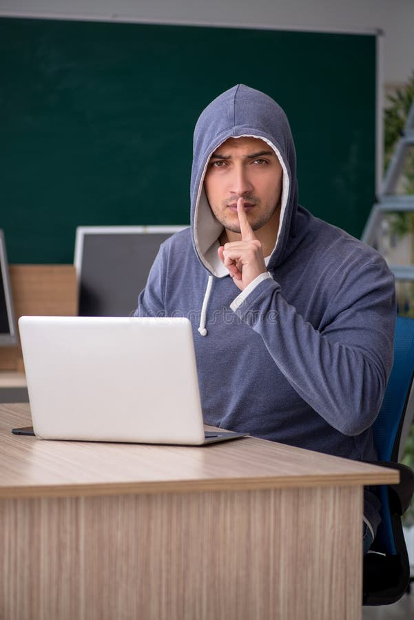 Young Male Hacker Sitting in the Classroom Stock Photo - Image of ...