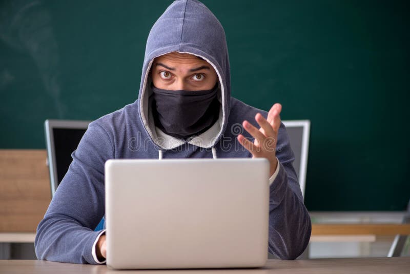 Young Male Hacker Sitting in the Classroom Stock Photo - Image of scam ...