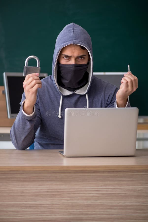 Young Male Hacker Sitting in the Classroom Stock Image - Image of ...