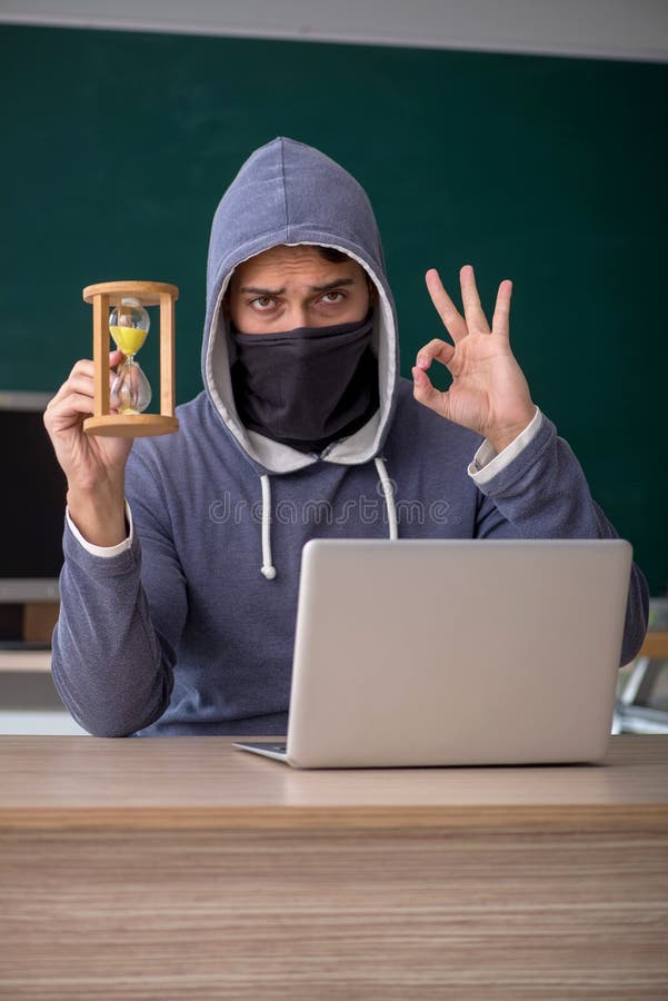 Young Male Hacker Sitting in the Classroom Stock Photo - Image of ...