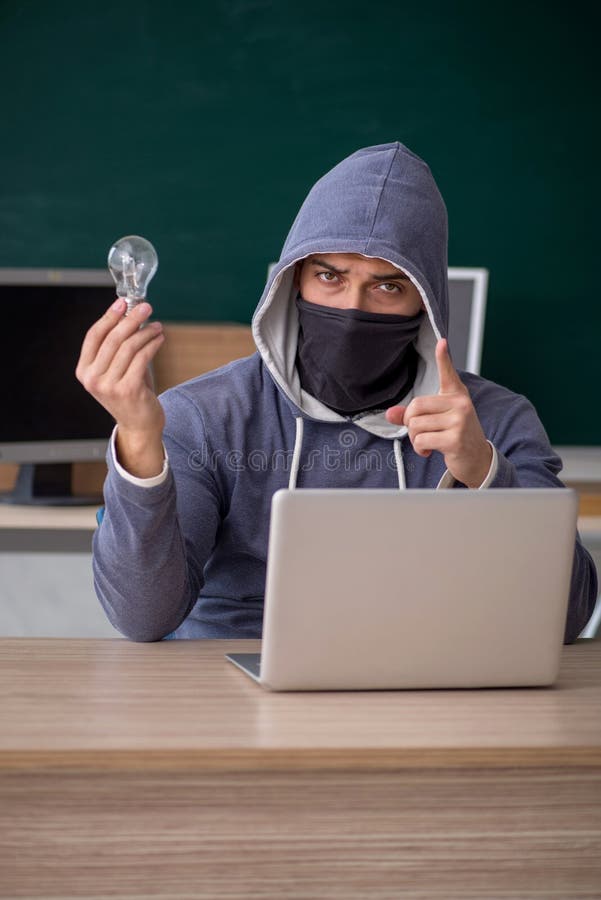 Young Male Hacker Sitting in the Classroom Stock Photo - Image of glass ...