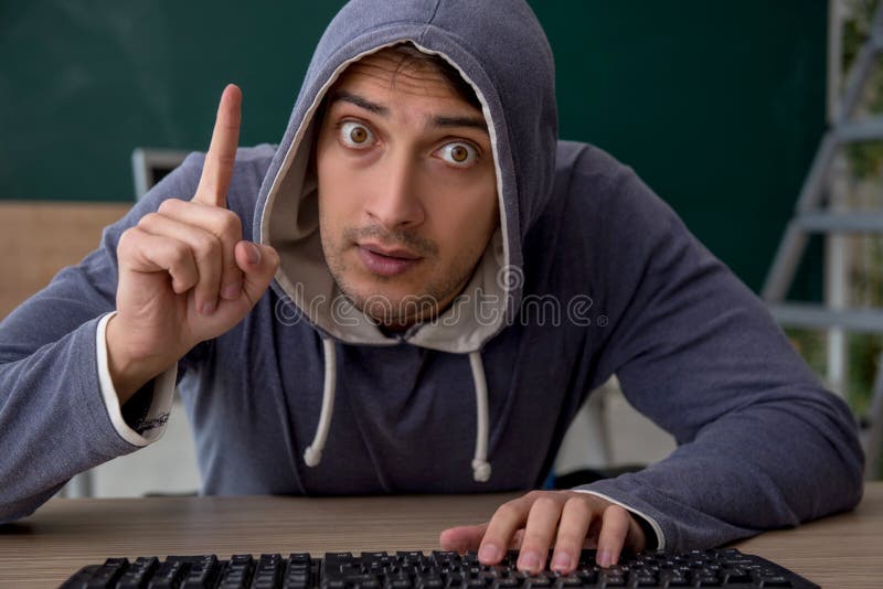Young Male Hacker Sitting in the Classroom Stock Image - Image of ...
