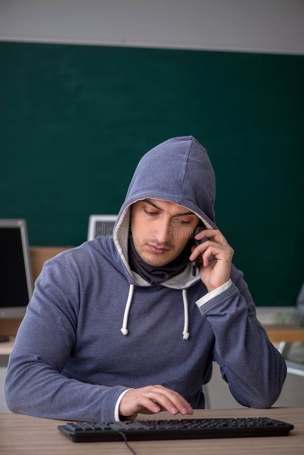 Young Male Hacker Sitting in the Classroom Stock Photo - Image of ...