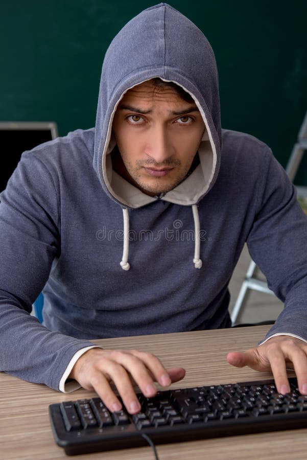 Young Male Hacker Sitting in the Classroom Stock Image - Image of ...