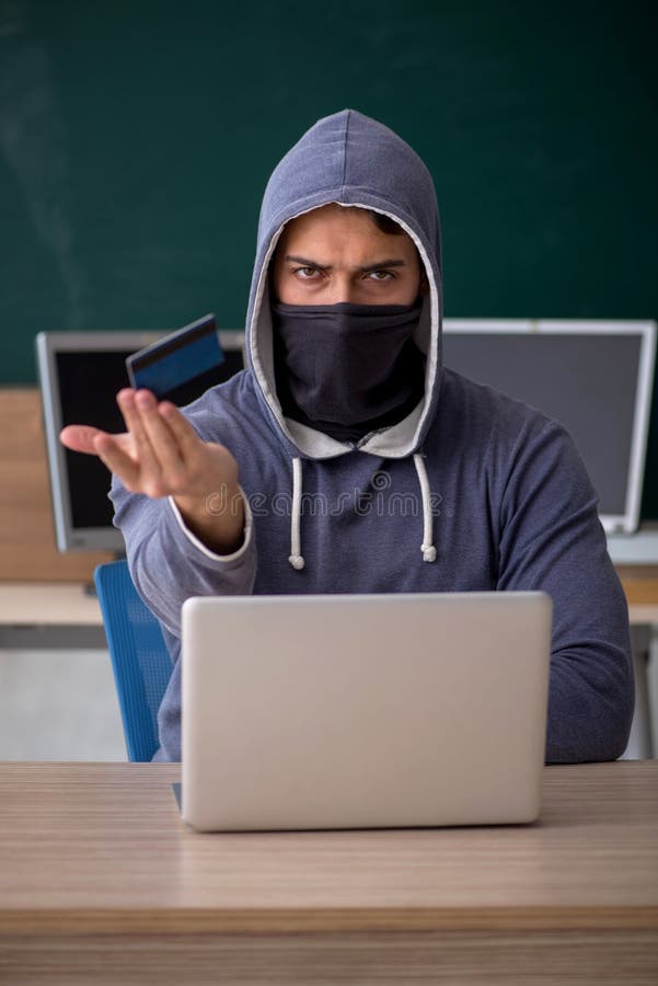 Young Male Hacker Sitting in the Classroom Stock Image - Image of ...