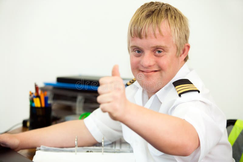 Young Handicapped Pilot Showing Thumbs Up in Office. Stock Photo ...