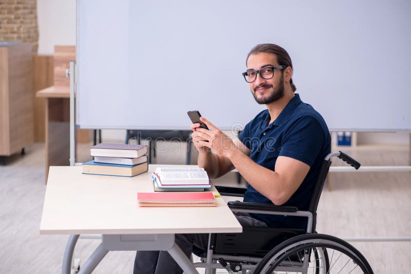 Young Male Handicapped Student in the Classroom Stock Photo - Image of ...