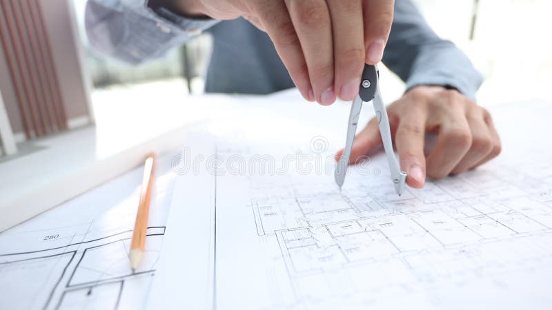 Draftsman Working Building Plan in Architectural Firm Closeup. Serious ...