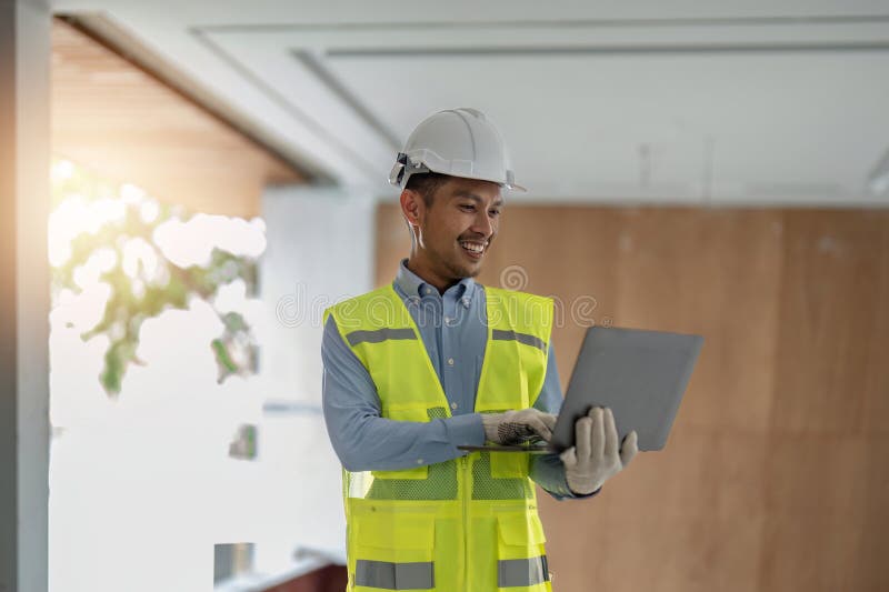 Young Handsome Asian Engineer Holding Laptop Looking Forward and ...