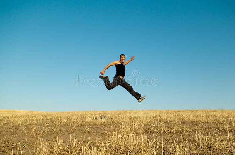 Young Handsome Asian Man Jumping Stock Image - Image of field, barley ...