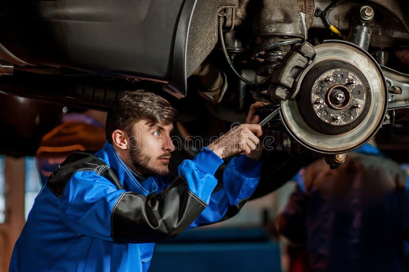 Young Handsome Auto Mechanic at Work Stock Photo - Image of automobile ...