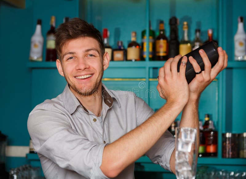Young Handsome Barman in Bar Shaking and Mixing Alcohol Cocktail Stock ...