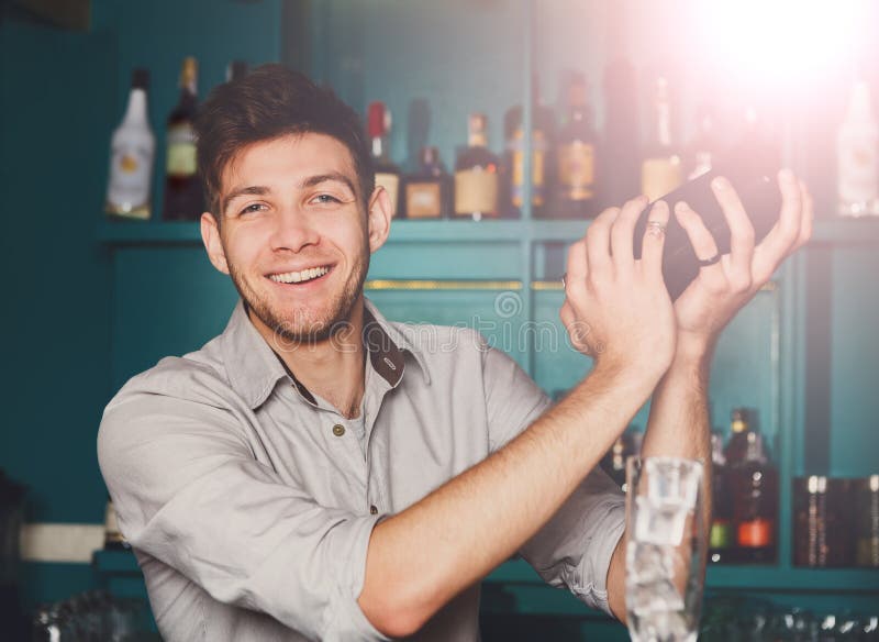 Young Handsome Barman in Bar Shaking and Mixing Alcohol Cocktail Stock ...