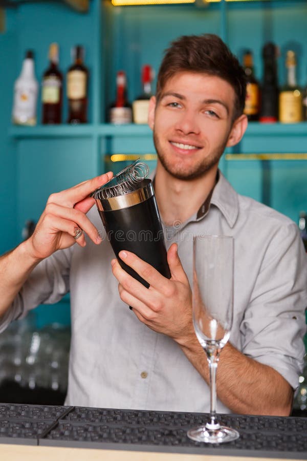 Young Handsome Barman in Bar Shaking and Mixing Alcohol Cocktail Stock ...